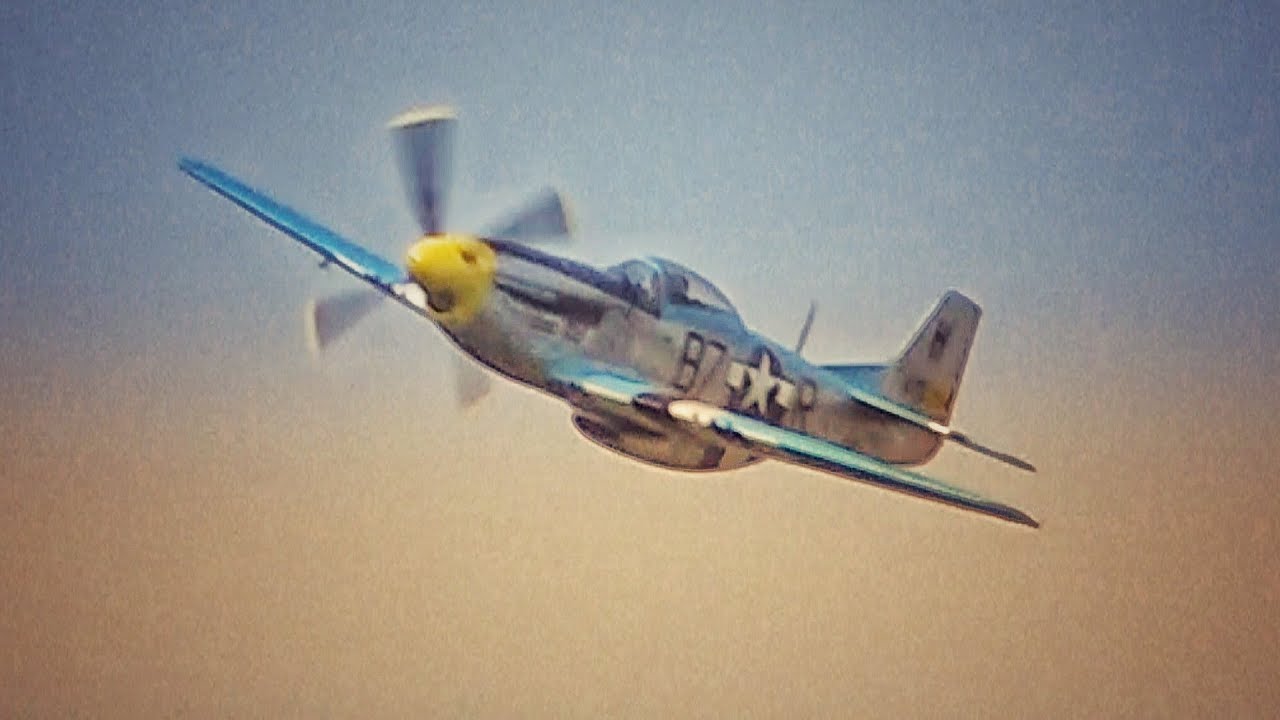 Watch this P-51D scream past the crowd - "The low pass feels violently ...