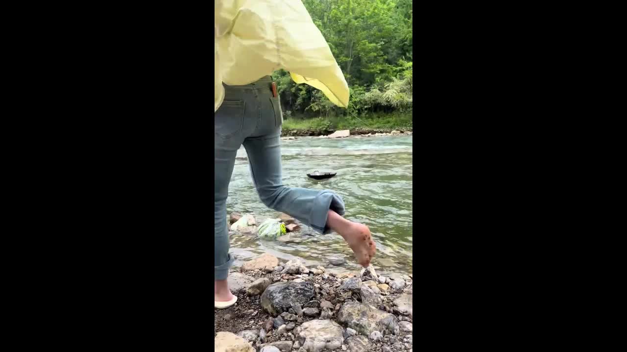 Cooking pan carried away by fast-moving river
