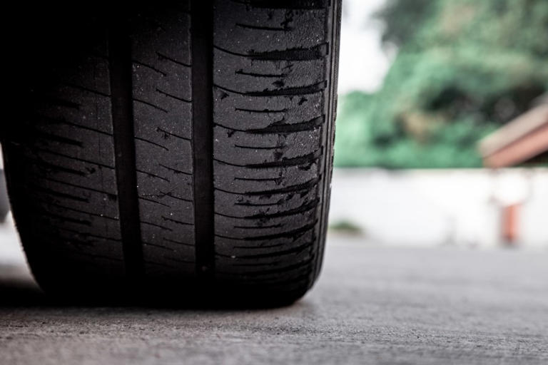 Woman finds man hiding in backseat of her car, police say