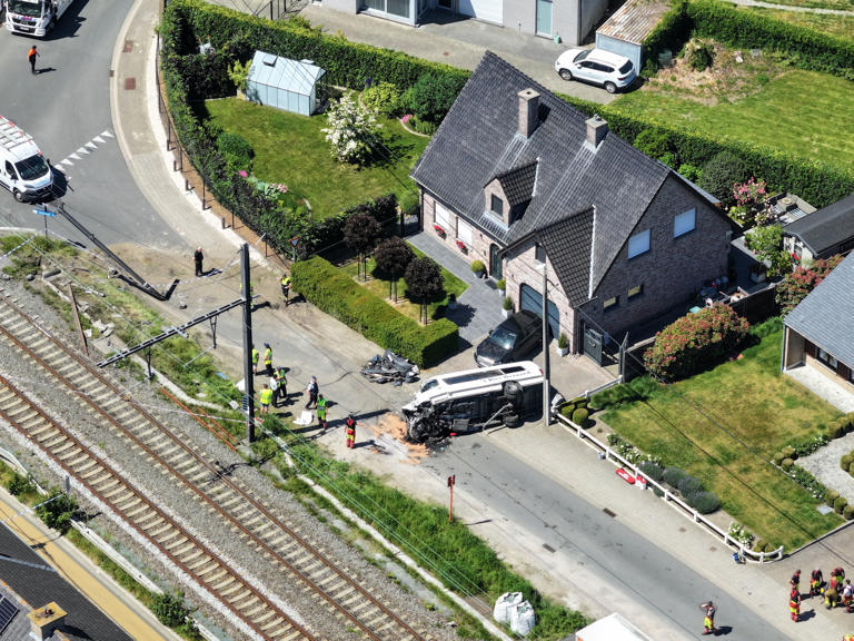 Two teenagers among four dead after train collides with school bus
