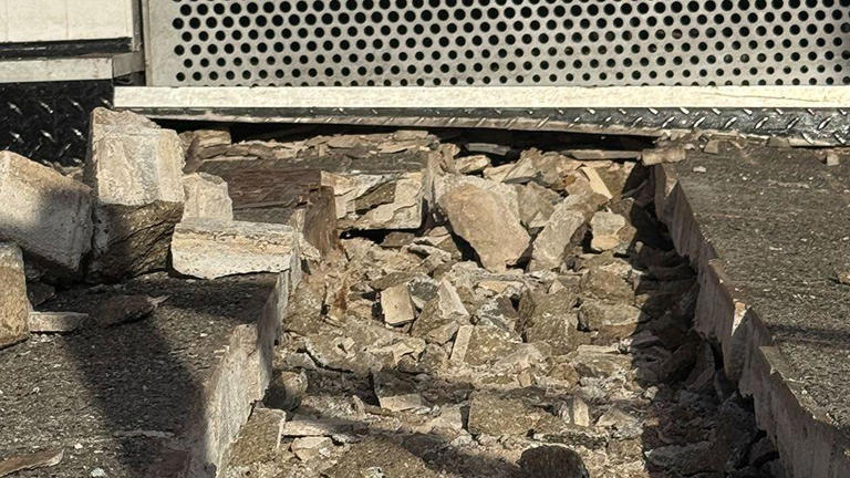 Firefighters smash pavement as heat makes it buckle