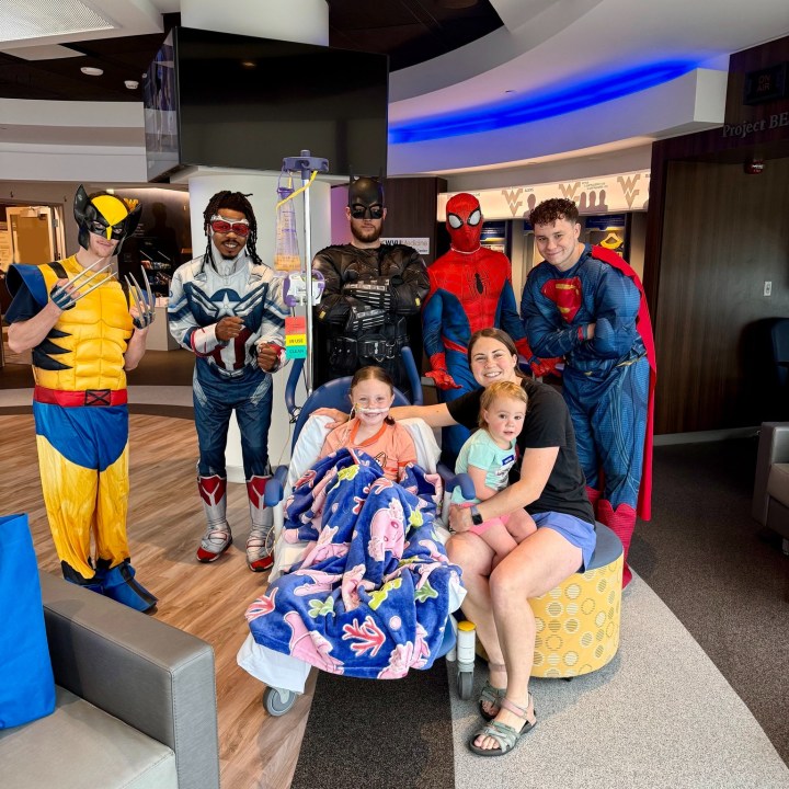 Superhero window washers surprise patients and their families at WVU ...