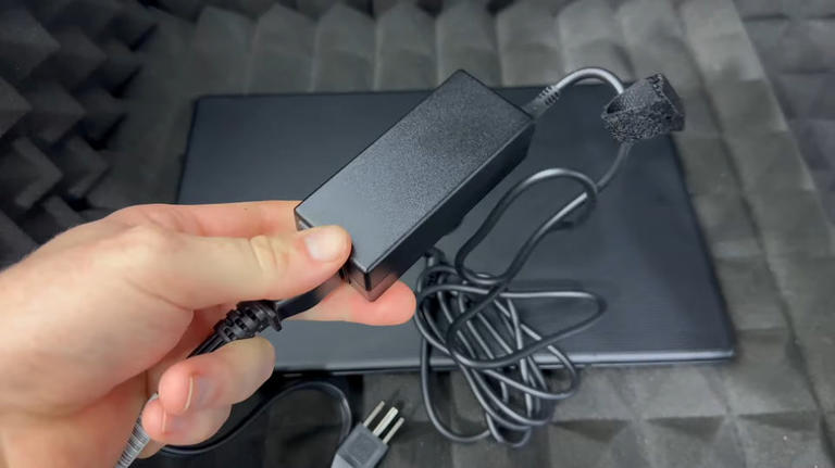 Why do most laptop chargers have a brick?