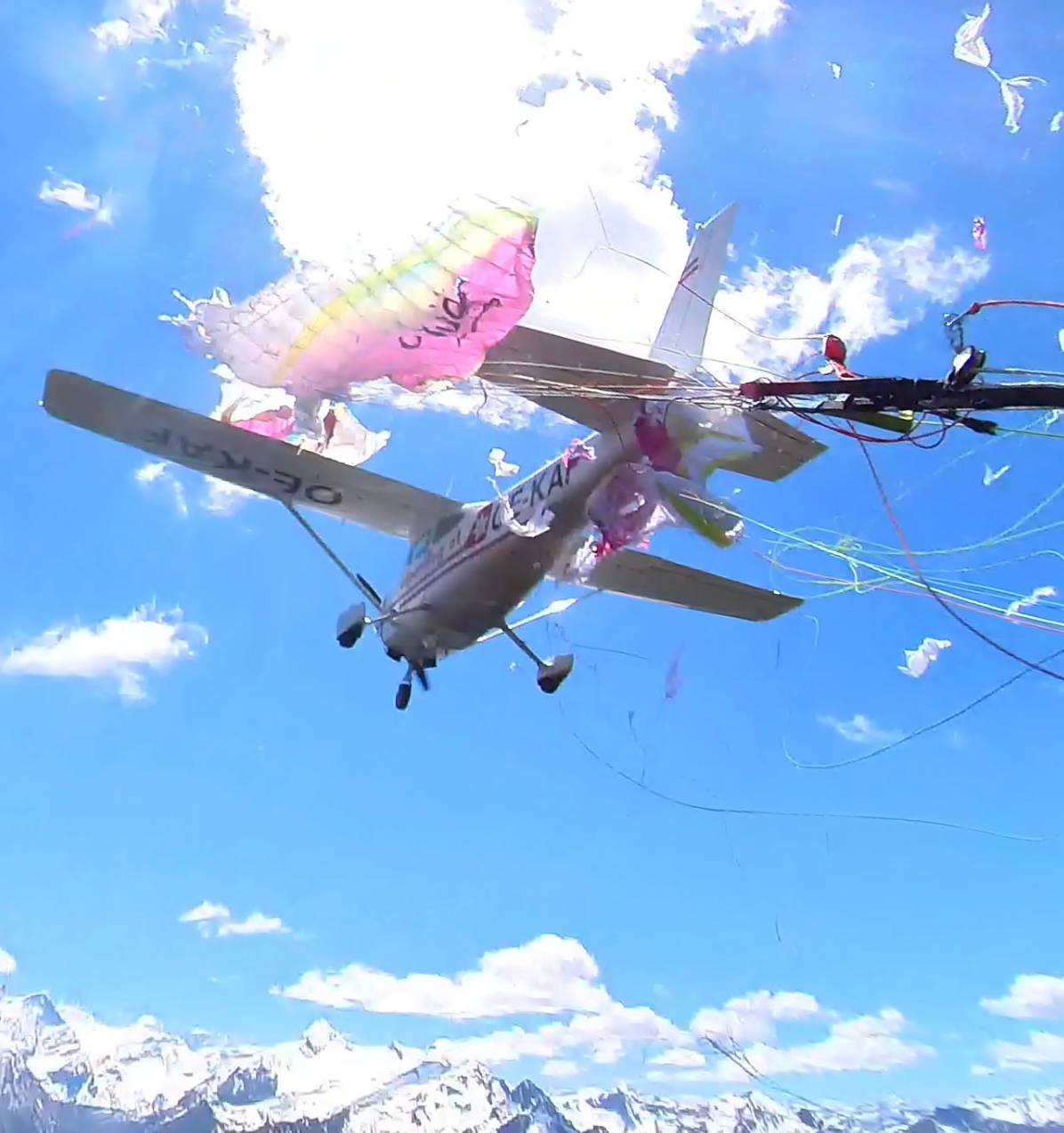 Horrifying moment paraglider collides with plane over Alps