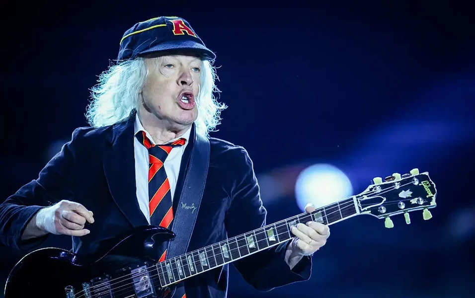 Angus Young brands early AC/DC love song 'regrettable' as Boyzone ...