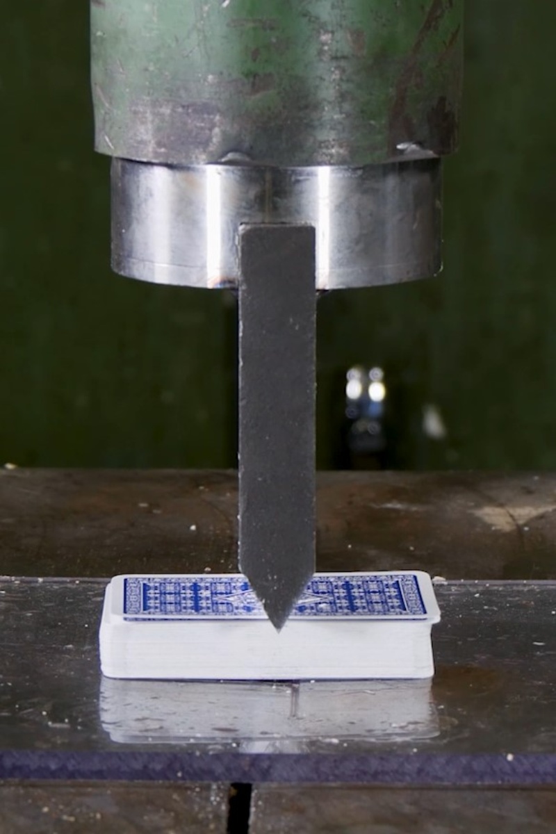 Crushing a deck of cards with a hydraulic press