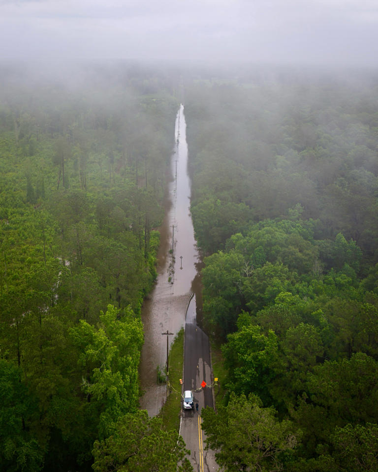 Rising river cuts off Mississippi subdivision as residents flee by boat