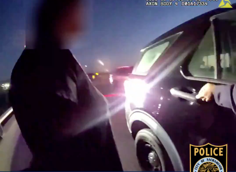 Heart-stopping moment cops rescue sobbing kid dangling dangerously from ...