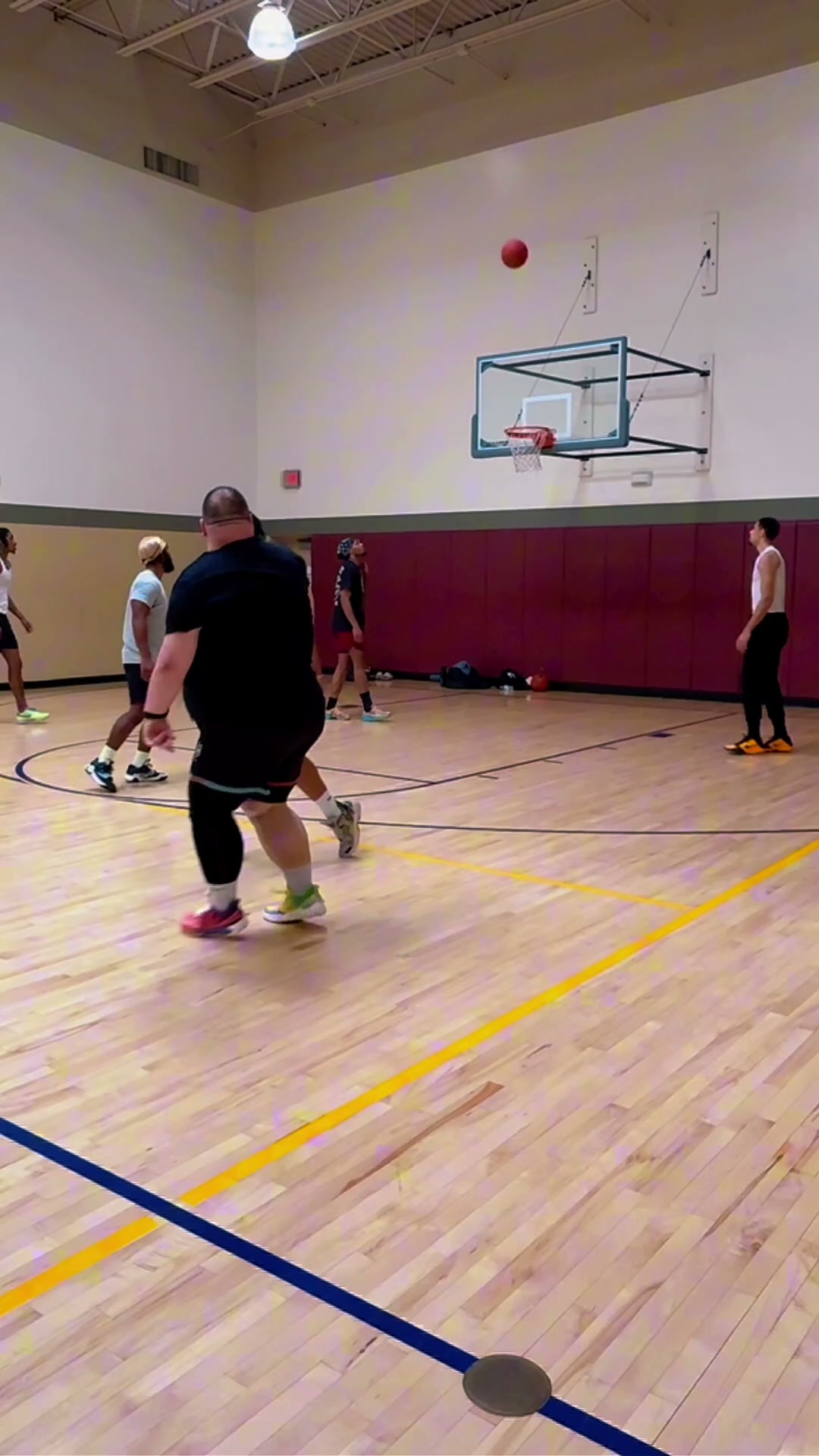 Unexpected basketball skills from the big guy at the gym