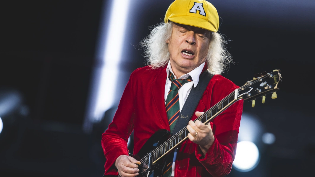 Angus Young brands early AC/DC love song 'regrettable' as Boyzone ...