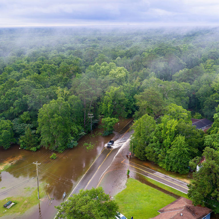 Rising river cuts off Mississippi subdivision as residents flee by boat