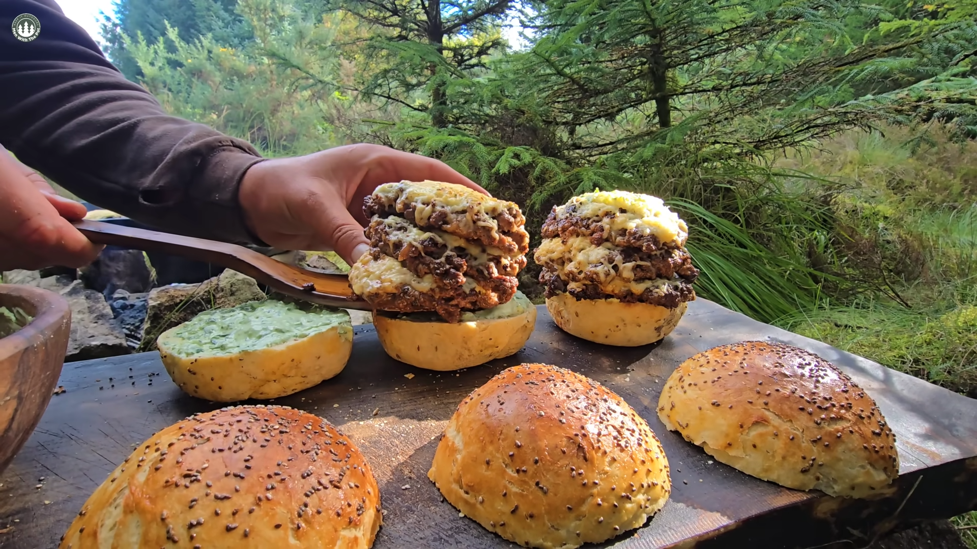 Watch how these cowboy beef burgers come together over open fire