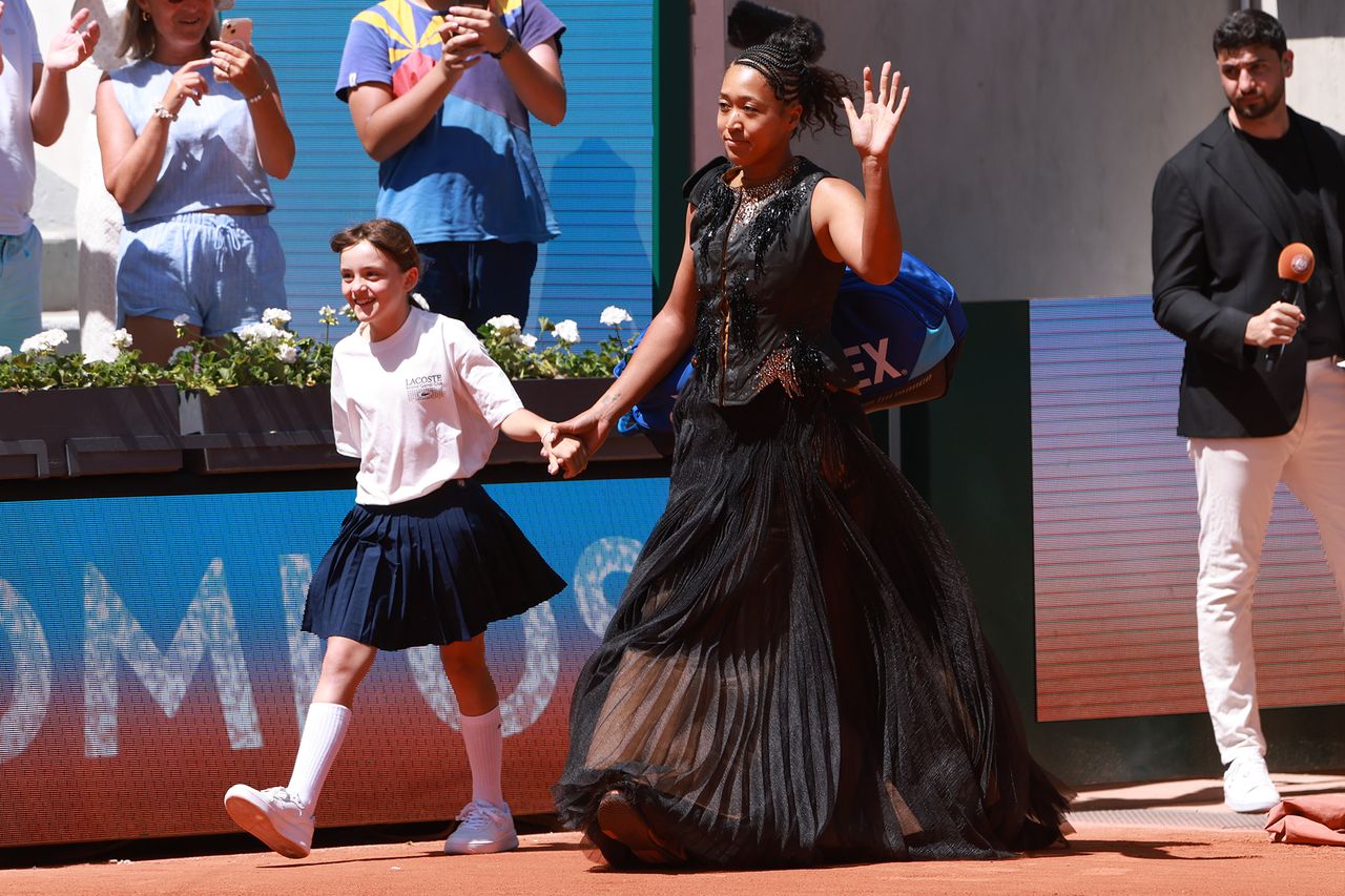 Naomi Osaka strips down into sizzling gold minidress after surprise ...