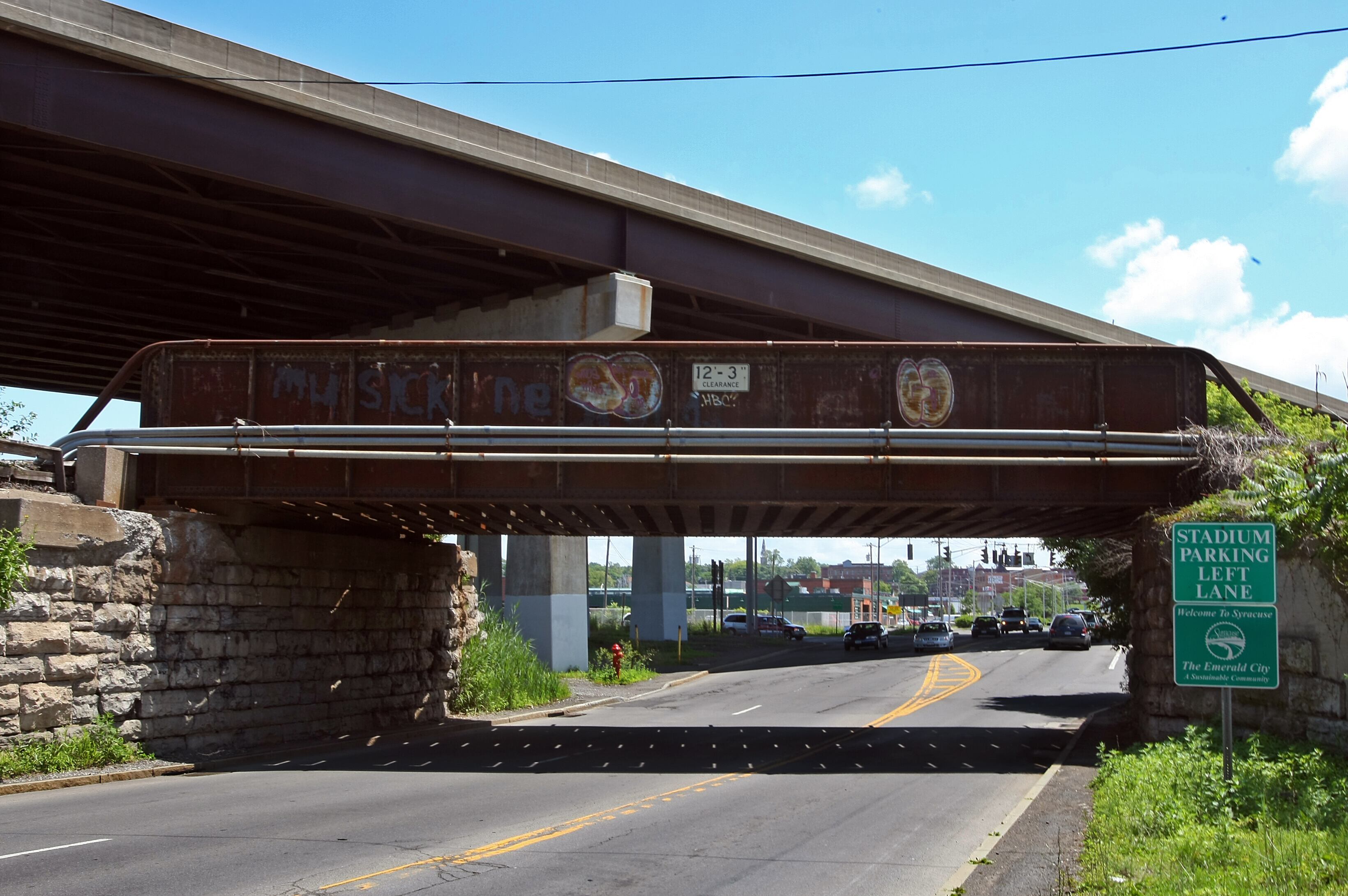 Tractor trailer hits bridge in Syracuse and keeps going with roof ...