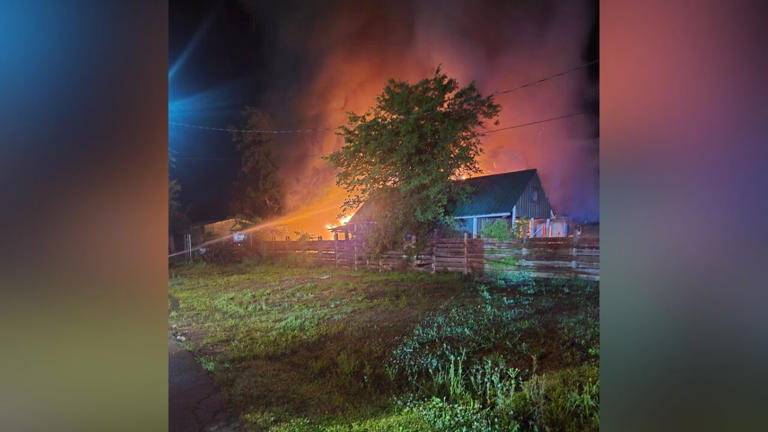 Crews battle live electrical lines during overnight house fire in ...