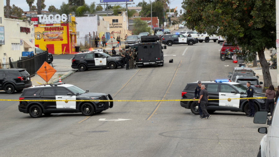 San Diego police, SWAT teams block road for police activity