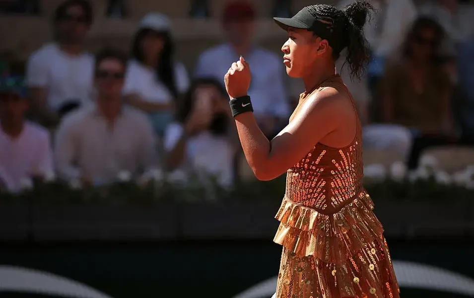 Osaka dazzles with gold dress and first-round French Open win