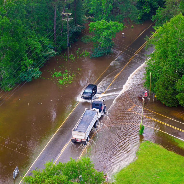 Rising river cuts off Mississippi subdivision as residents flee by boat