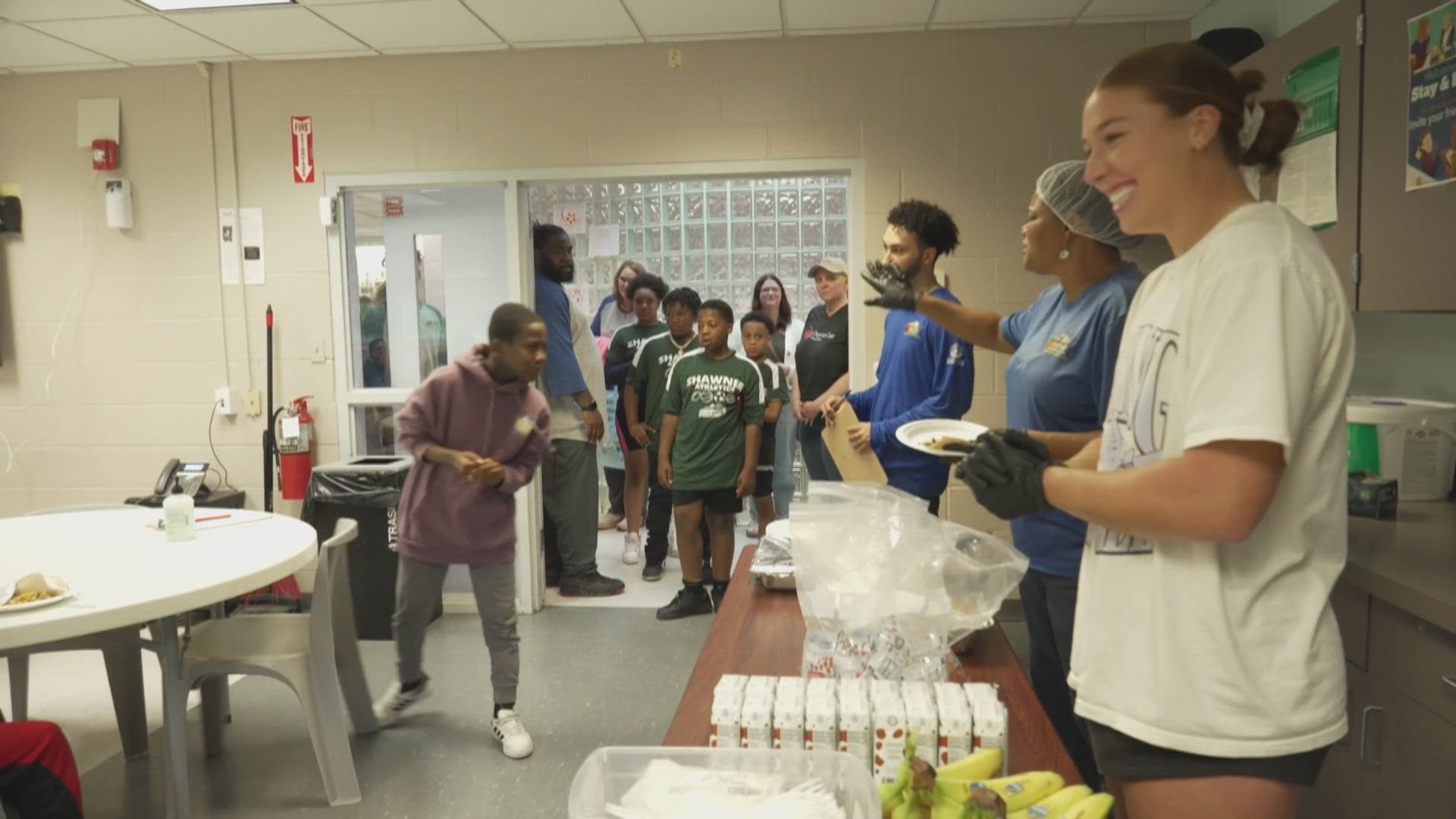 Racing Lou goalkeeper hands out meals for Dare to Care
