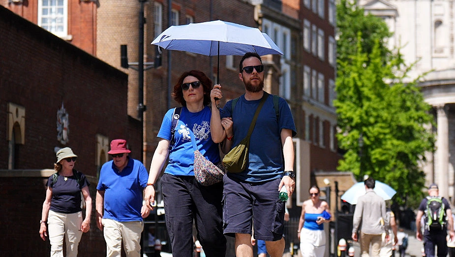 Record May heat persists as UK braces for storms