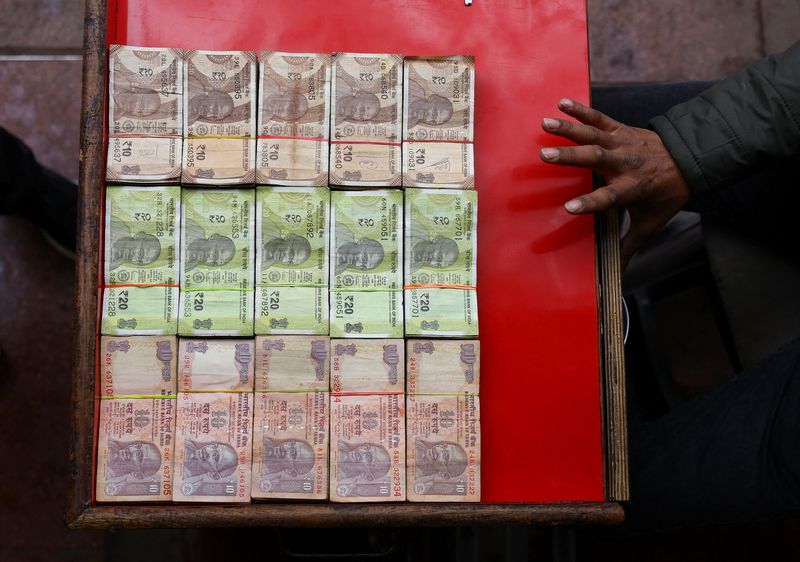 State-run banks' intermittent dollar sales cushion rupee, forward ...
