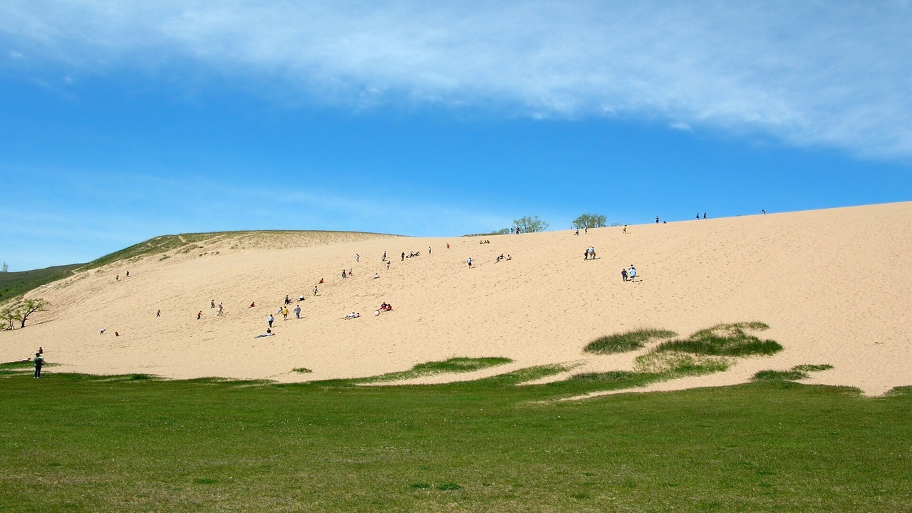 You can stand on a 450-foot sand cliff above open water in Michigan and ...