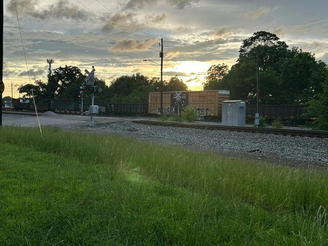 Harris Homes neighbors stuck for hours as stopped train keeps students ...