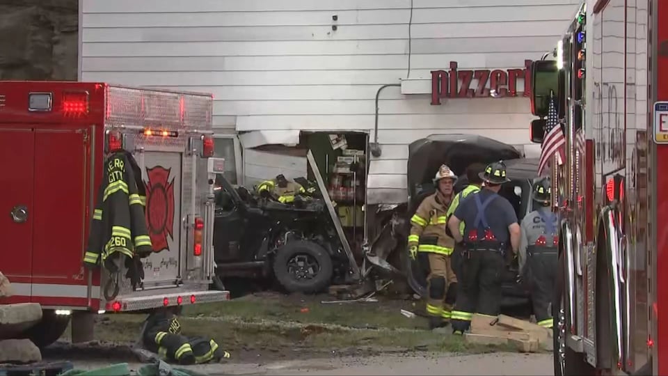 Person injured after multiple vehicles crash into local pizza shop