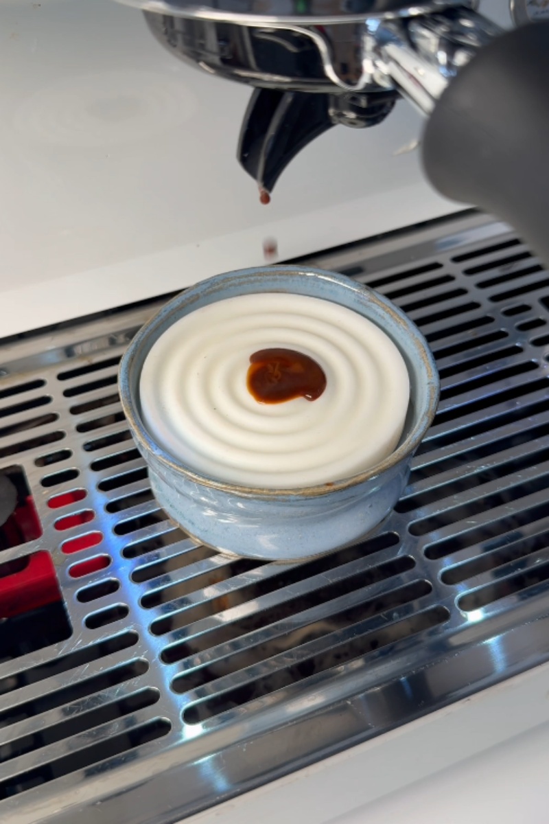 Minimalist espresso drop cream coffee art