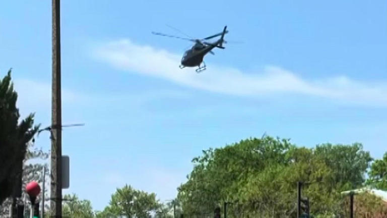 Why is there a dark helicopter flying low above Boston?
