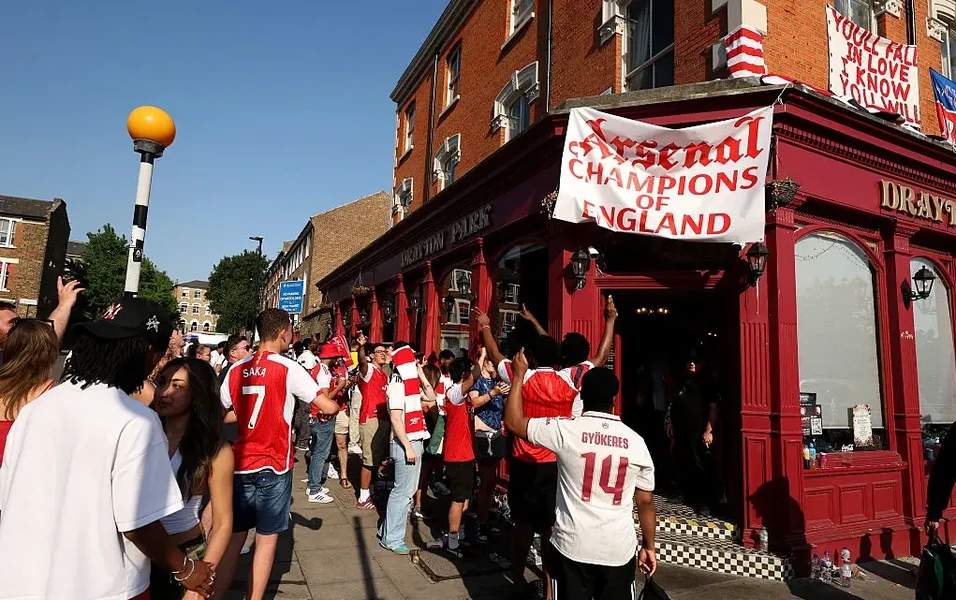Arsenal and Spurs players celebrate together in Mayfair
