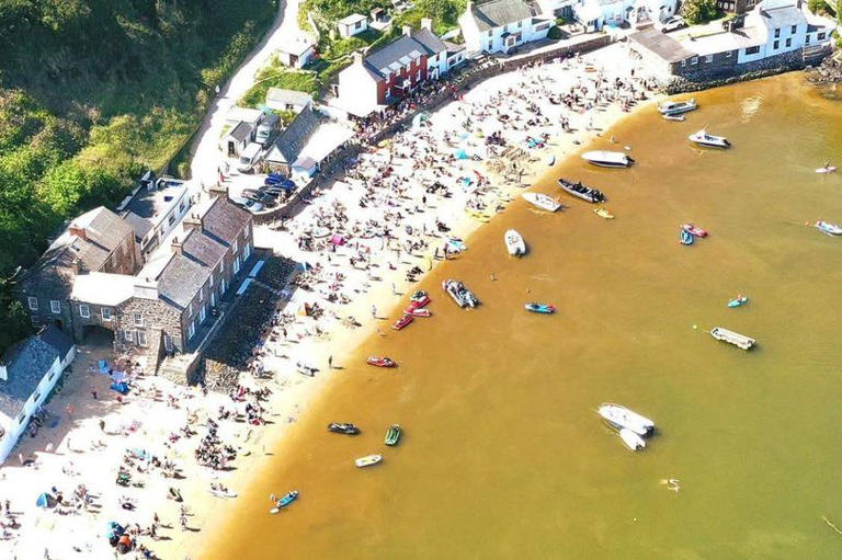 Sea turns brown at well-loved UK beach as hundreds witness 'frothy scum'