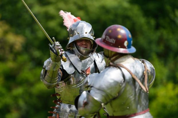 Thousands flock to castle for medieval festival on hottest days of the year