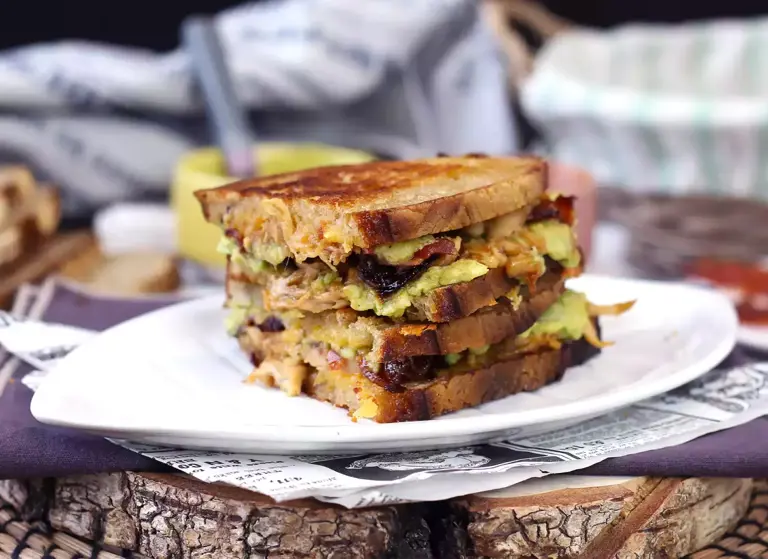 Maxi grilled cheese sandwich: cheddar, shredded chicken, avocado, bacon