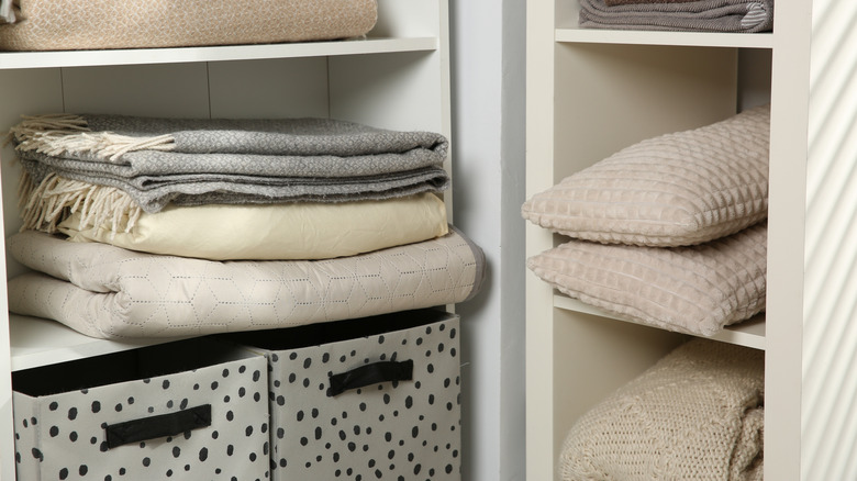 Ditch overstuffed shelves & bins: A better way to store blankets out of ...