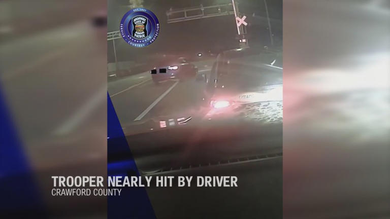 Impaired driver hits Kansas Highway Patrol car, narrowly missing officer