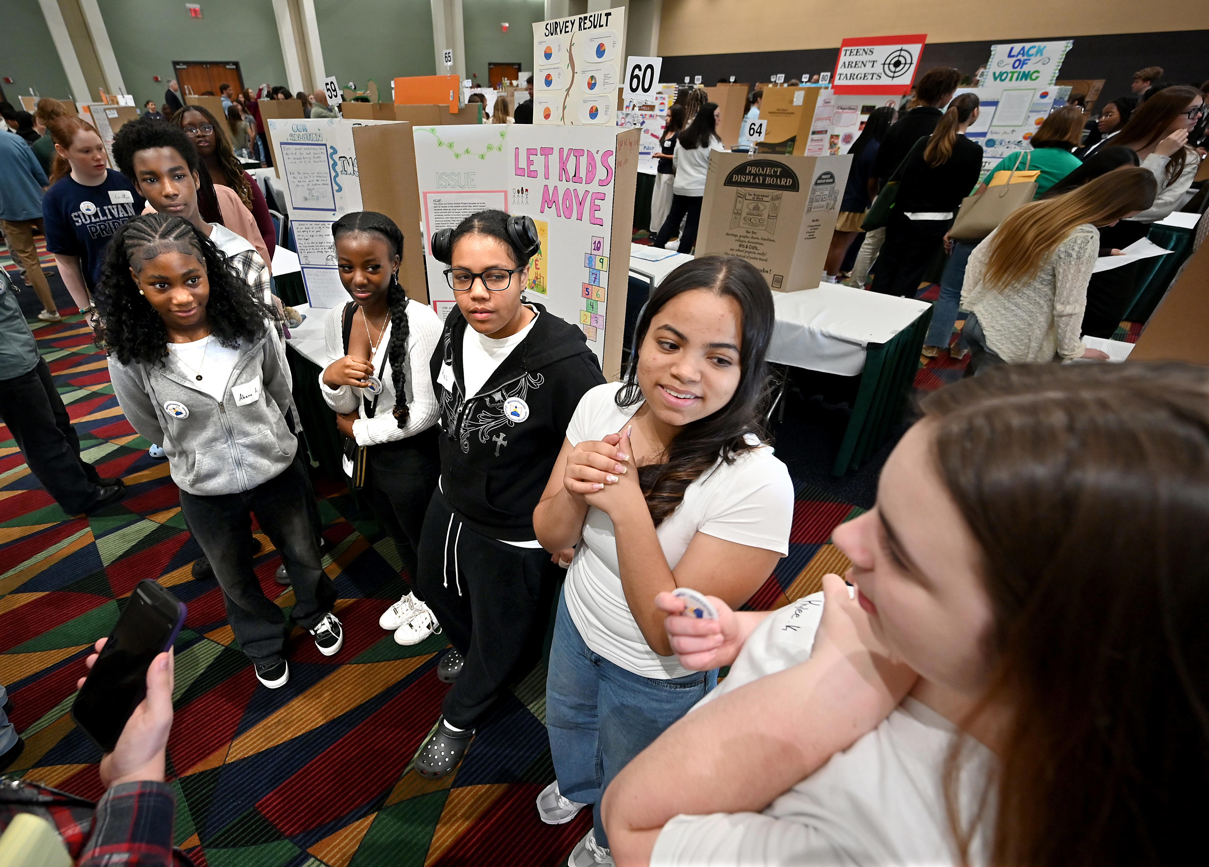 Local students showcase civics projects on mental health, AI, ICE