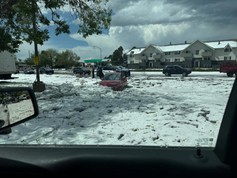 Woman rescued after driving into hidden flood in Aurora