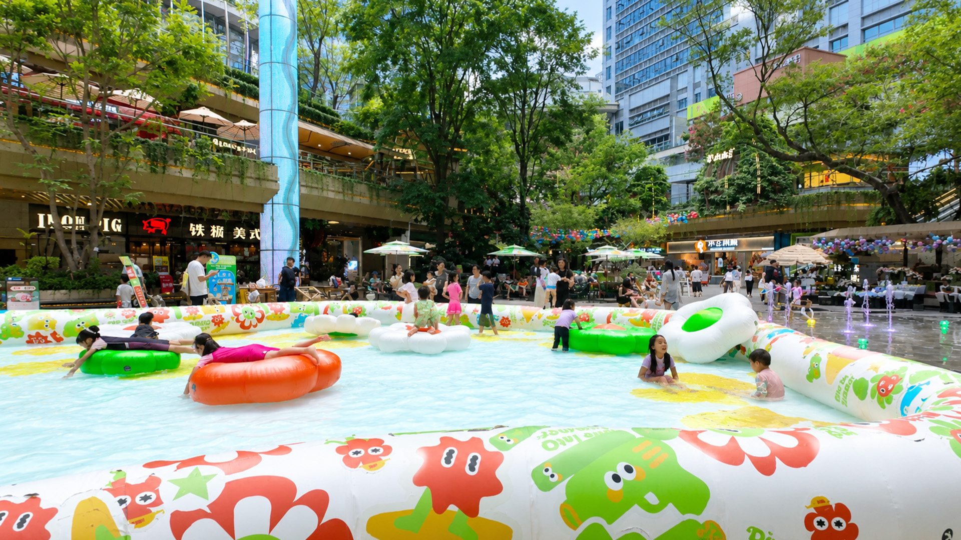 Children enjoy water play activities inside this shopping mall