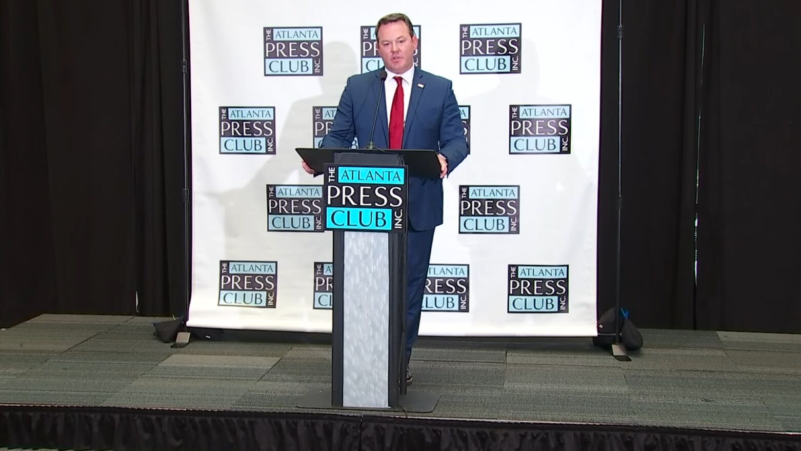 Jones debates empty podium as Jackson campaigns elsewhere