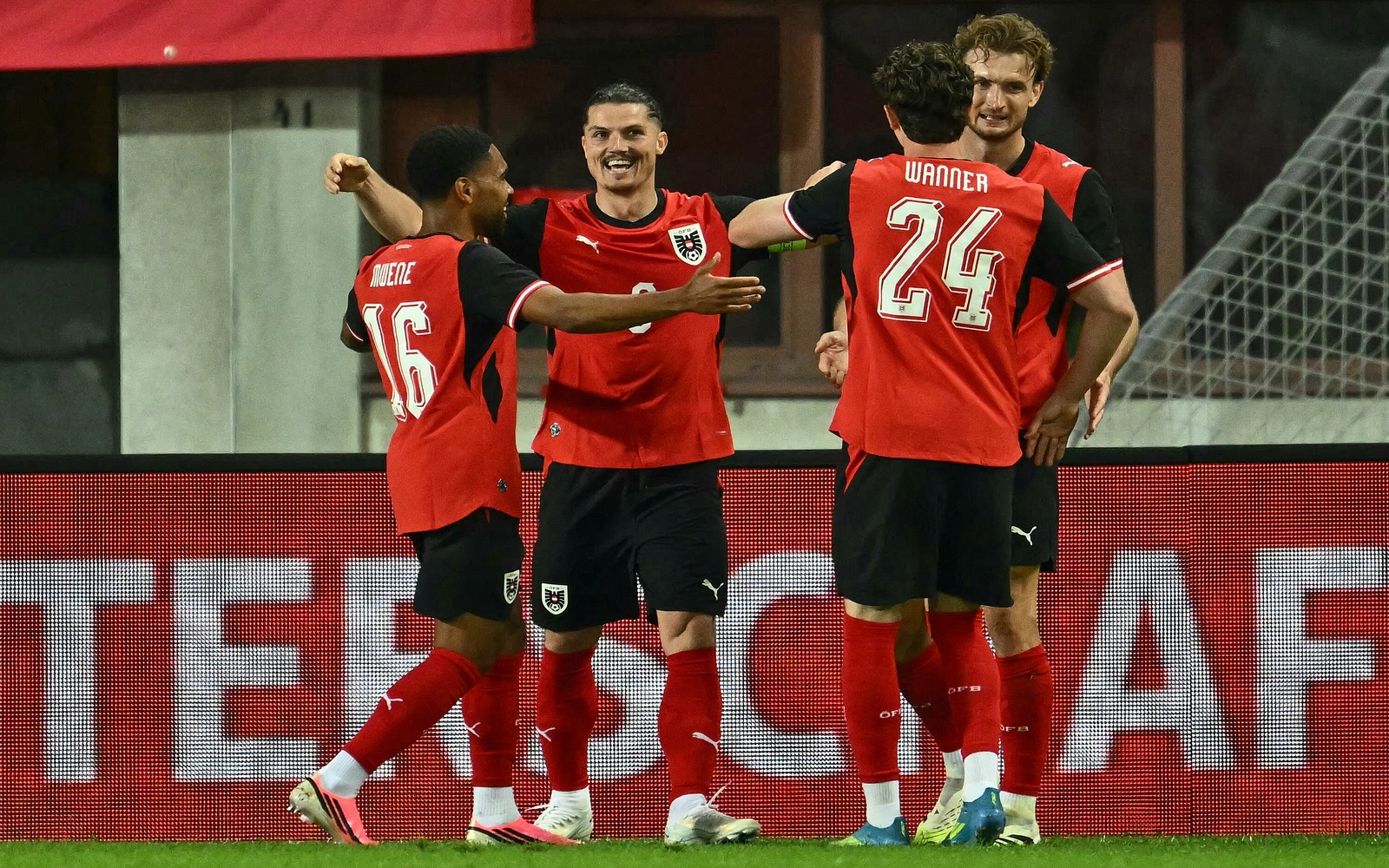 Austria fight back from early red card to beat Tunisia