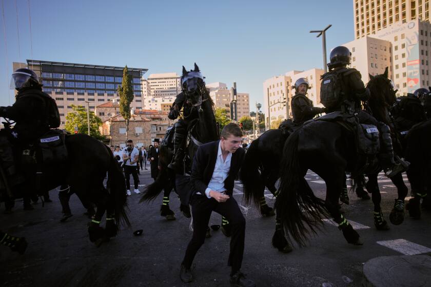 Ultra-Orthodox protesters block roads and trains across Israel over ...