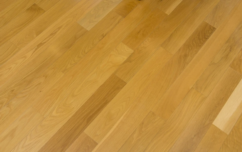 Designers swap sleek minimalism for warm, textured flooring in 2026