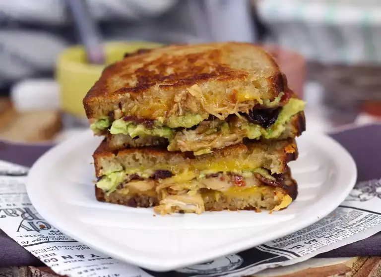 Maxi grilled cheese sandwich: cheddar, shredded chicken, avocado, bacon