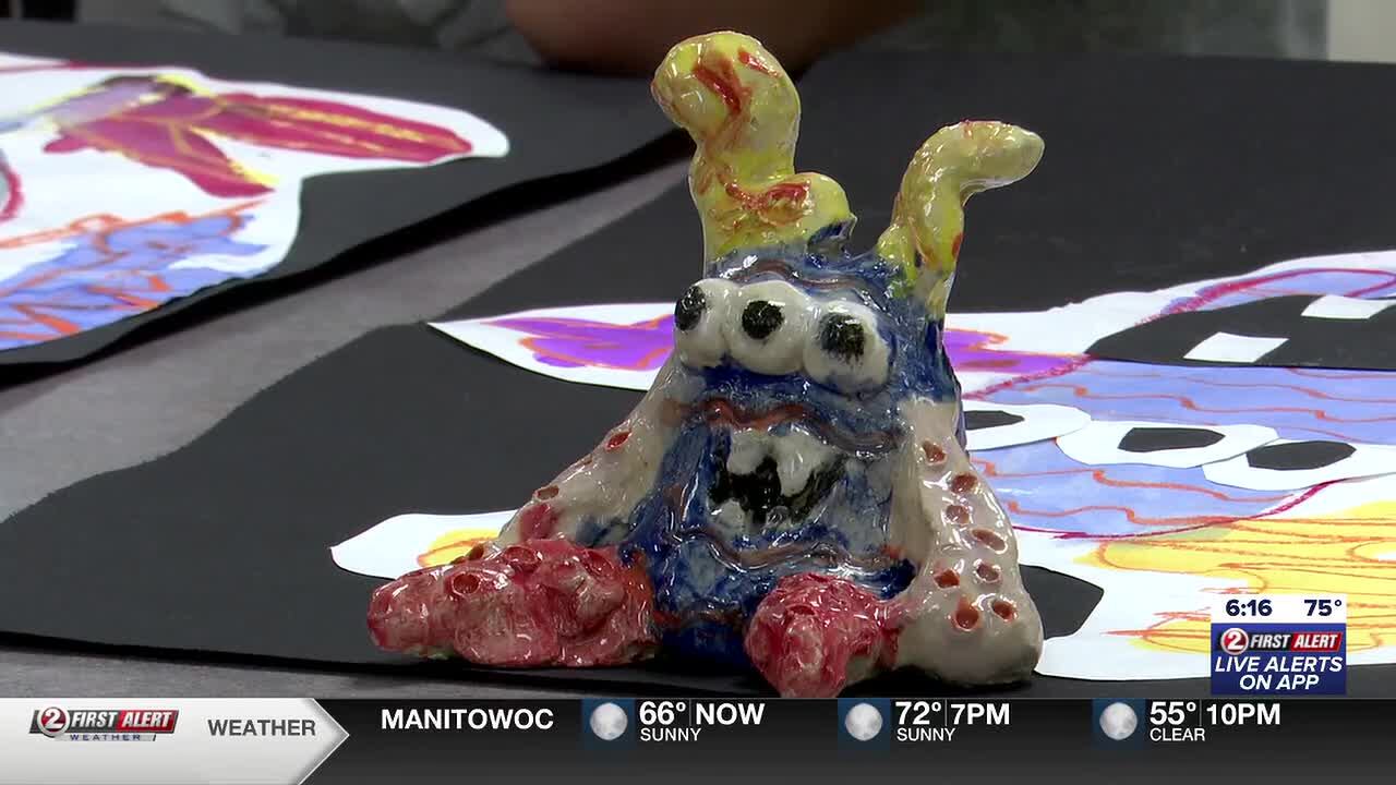 Ashwaubenon High School art students surprise first graders with clay ...