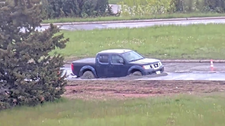 Pickup truck driver moves 'road closed' sign, immediately gets stuck in ...