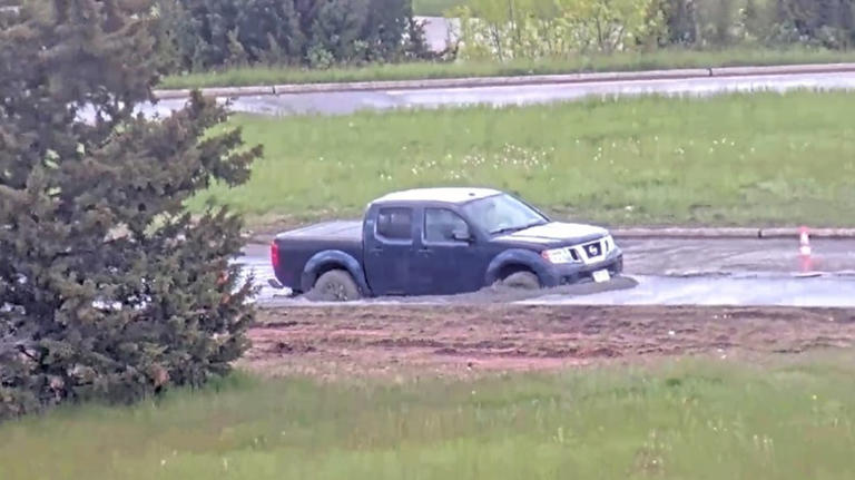 Pickup truck driver moves 'road closed' sign, immediately gets stuck in ...