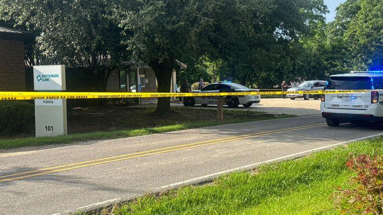 Woman hospitalized, suspect in custody after shots fired near Purvis ...