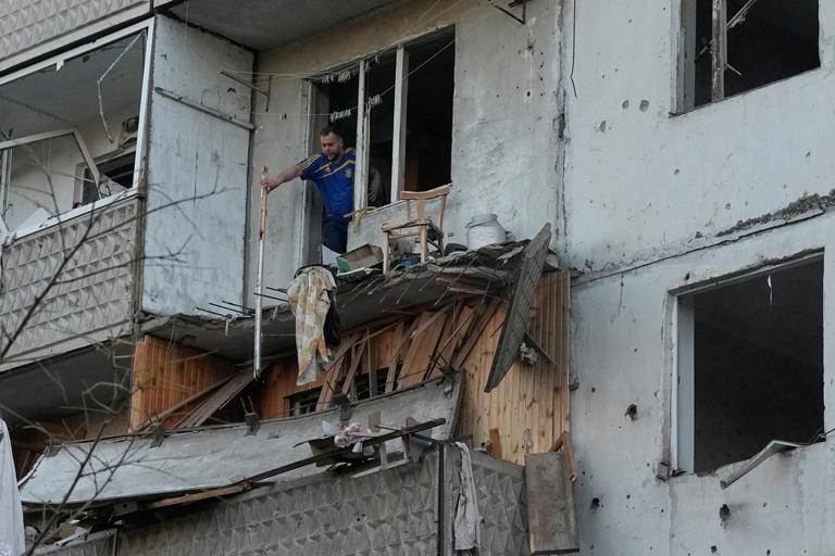 Russian attack on Ukraine capital kills at least 3 and traps others in ...