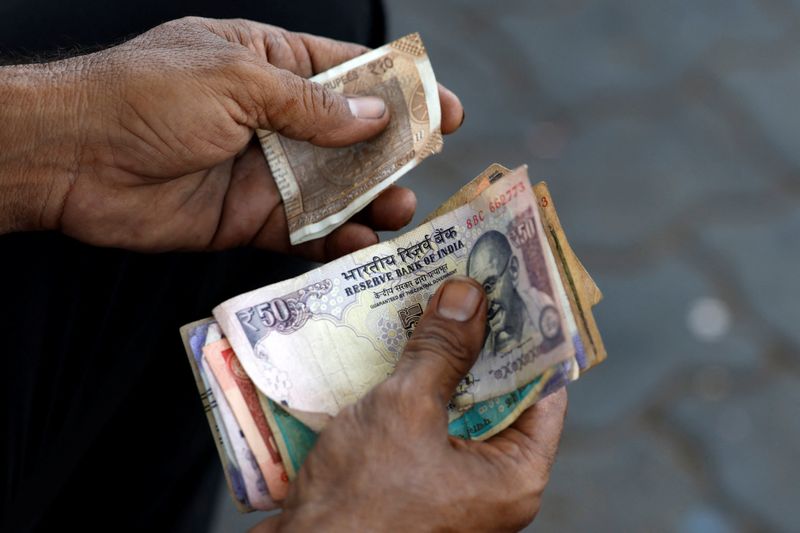 Rupee slips on weak stocks, importer hedging but state-run banks cushion